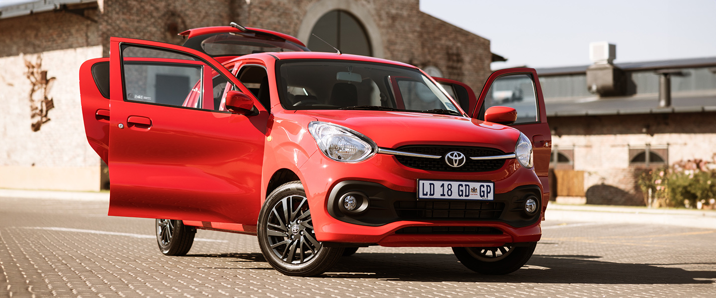 The Toyota Vitz parked in a driveway